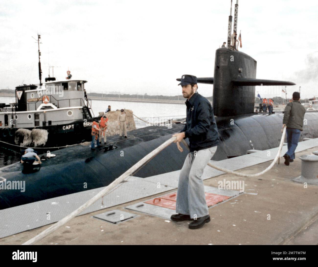 Line handlers tie up the nuclear-powered strategic missile submarine ...