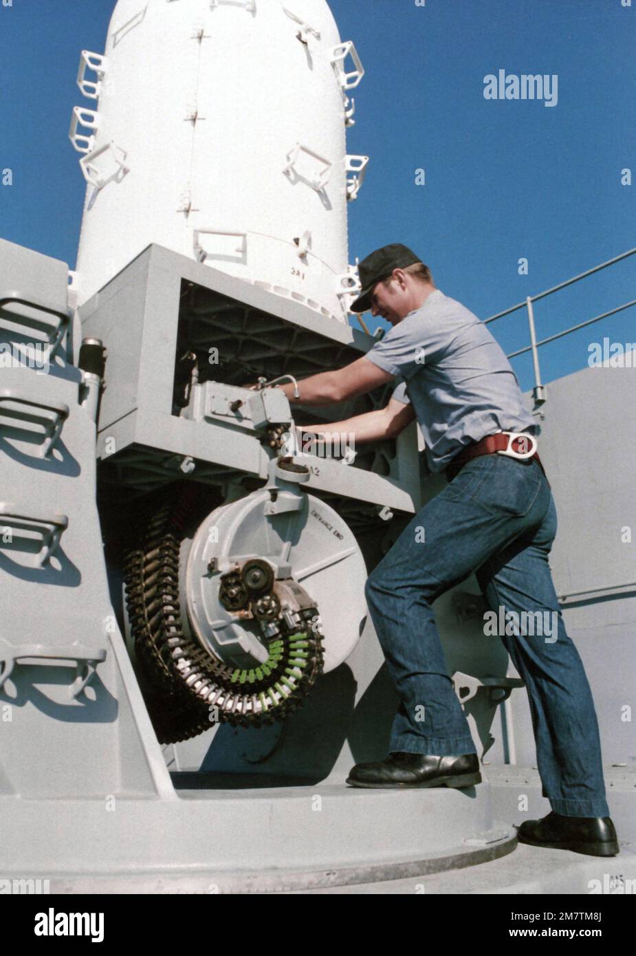 A fire control technician G (Gun Fire Control) works on components of ...