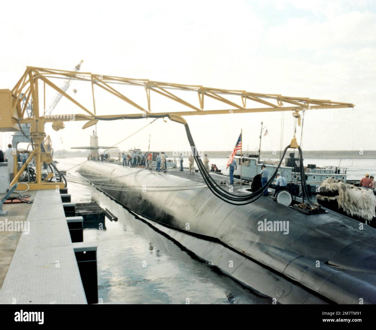 Blue crew members prepare to bring shore power onto the nuclear-powered ...