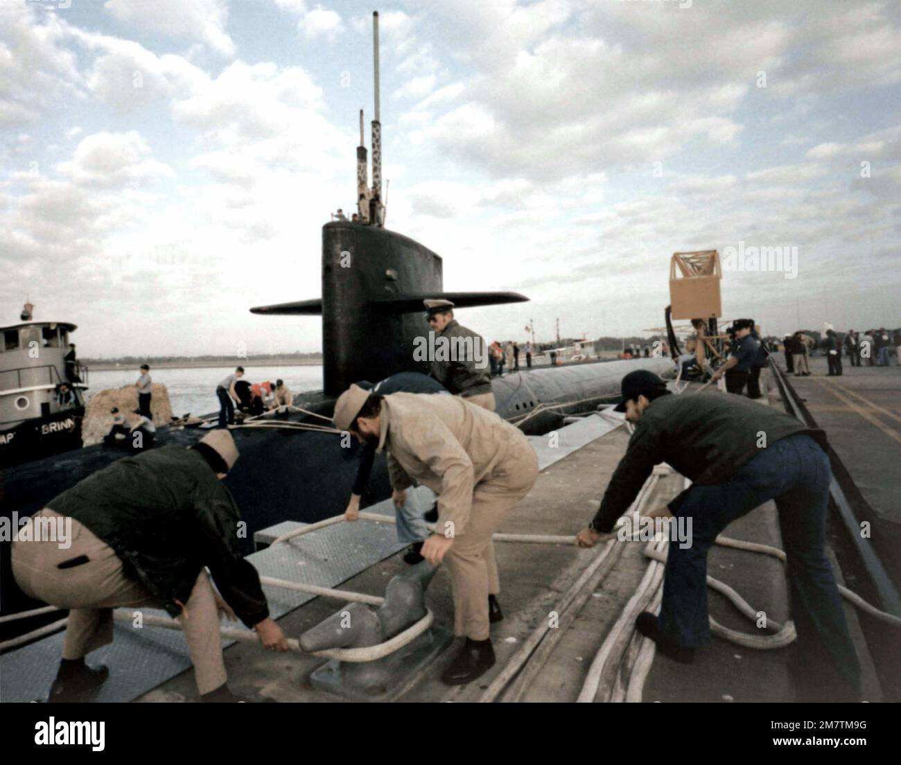 Line handlers tie up the nuclear-powered strategic missile submarine ...