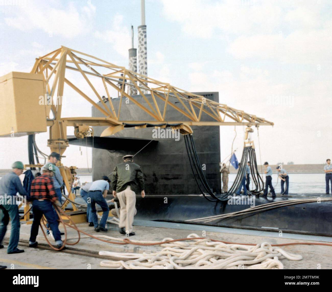 Line handlers tie up the nuclear-powered strategic missile submarine ...