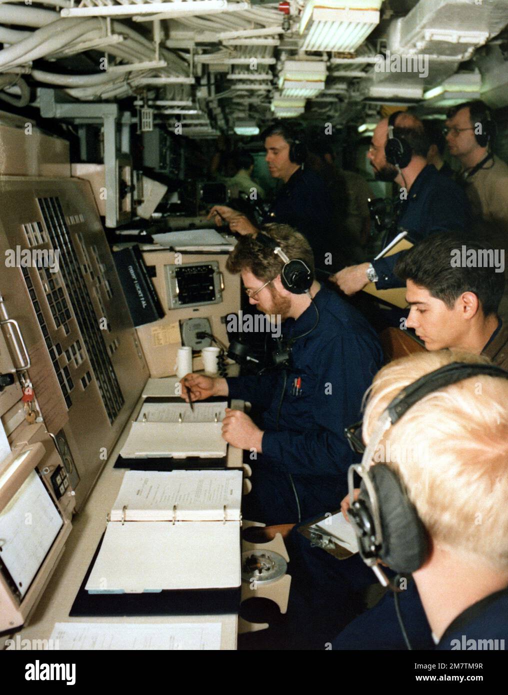 Crewmen stand by at the battle stations in the missile control center ...