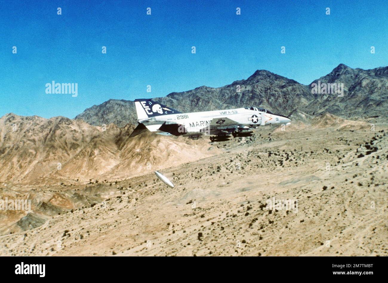 An air-to-air right side view of a Marine F-4 Phantom II aircraft ...