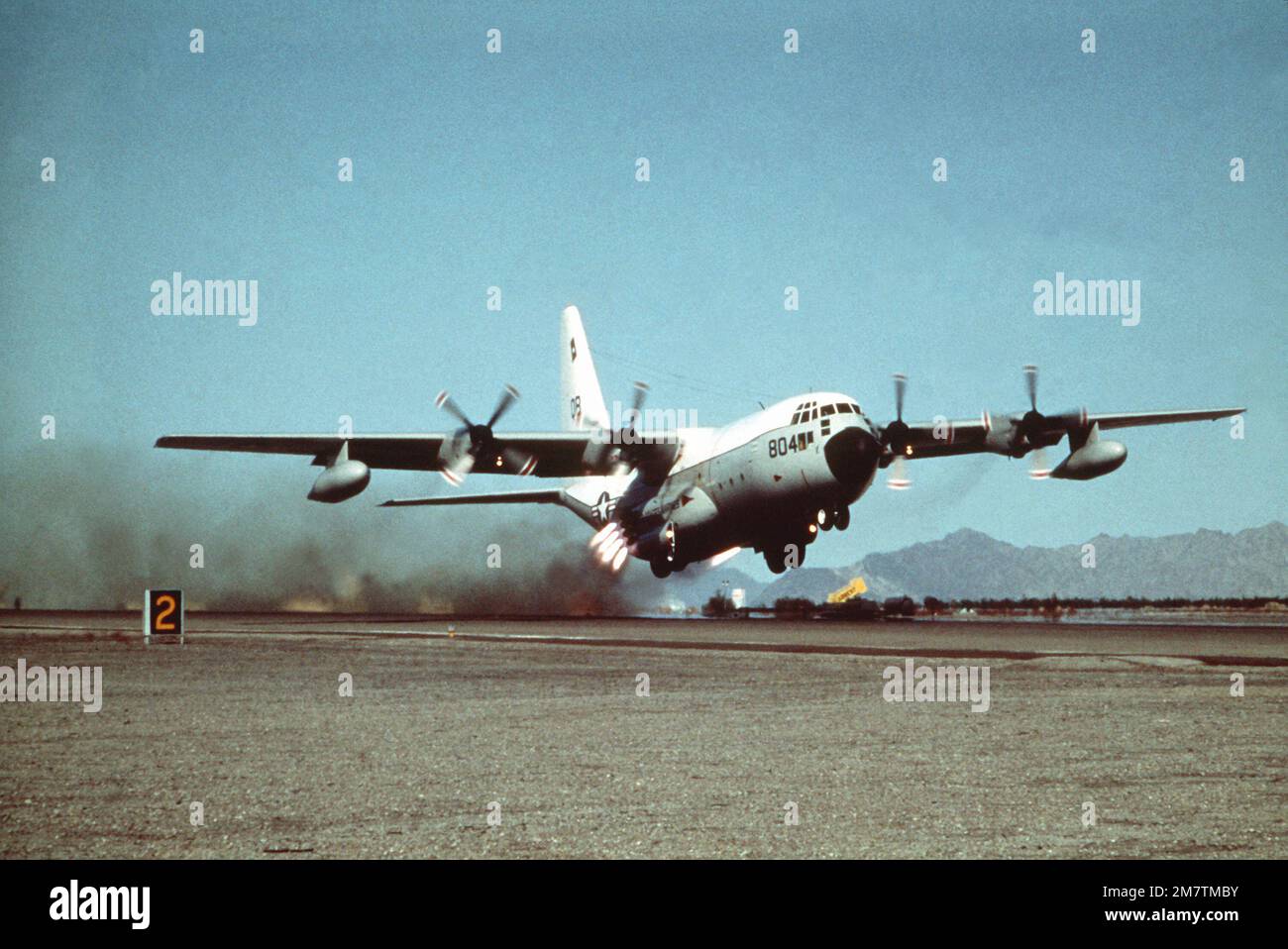 A right front view of a Marine KC-130 Hercules aircraft using its ...