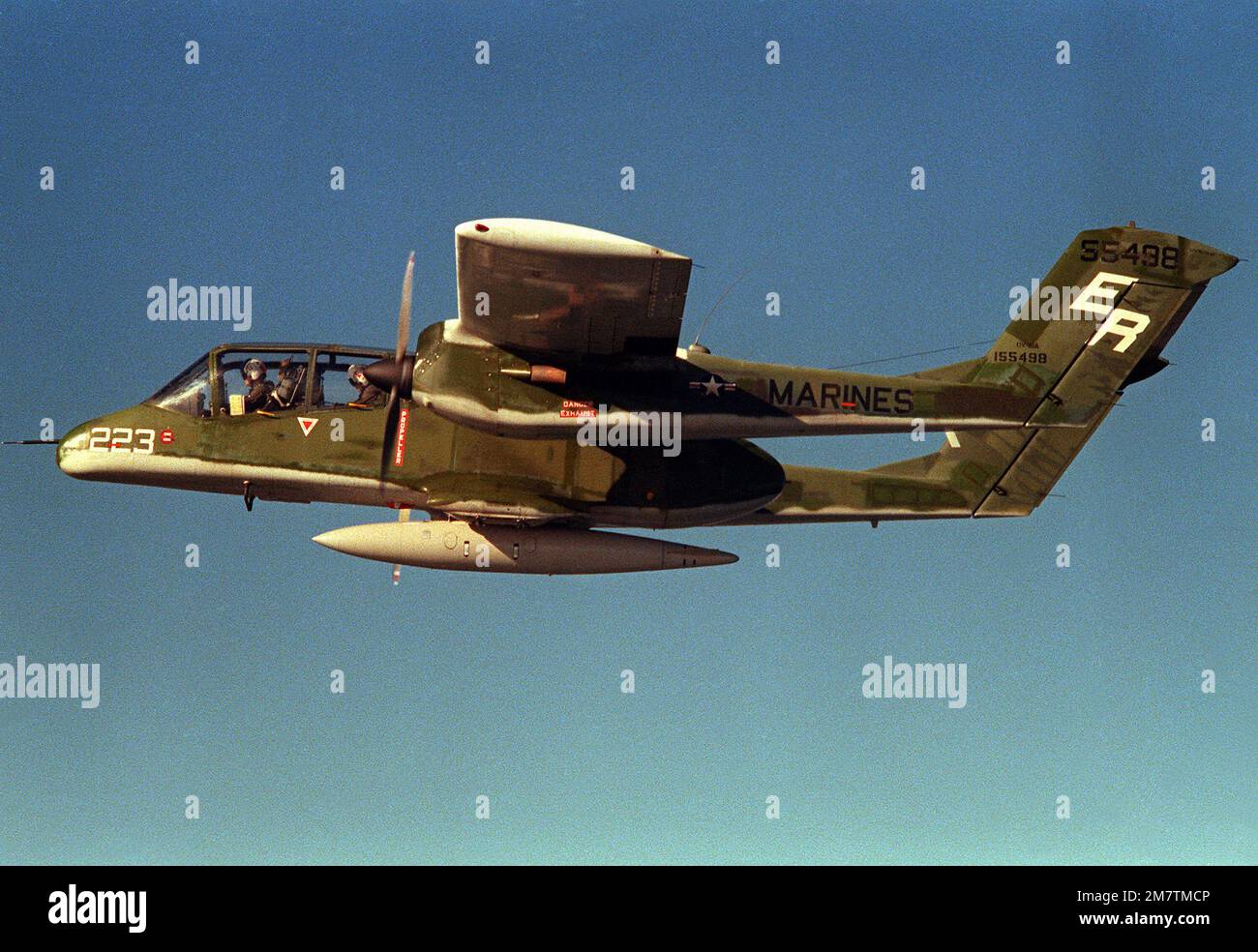 An air-to-air left side, low angle view of a Marine OV-10A Bronco ...
