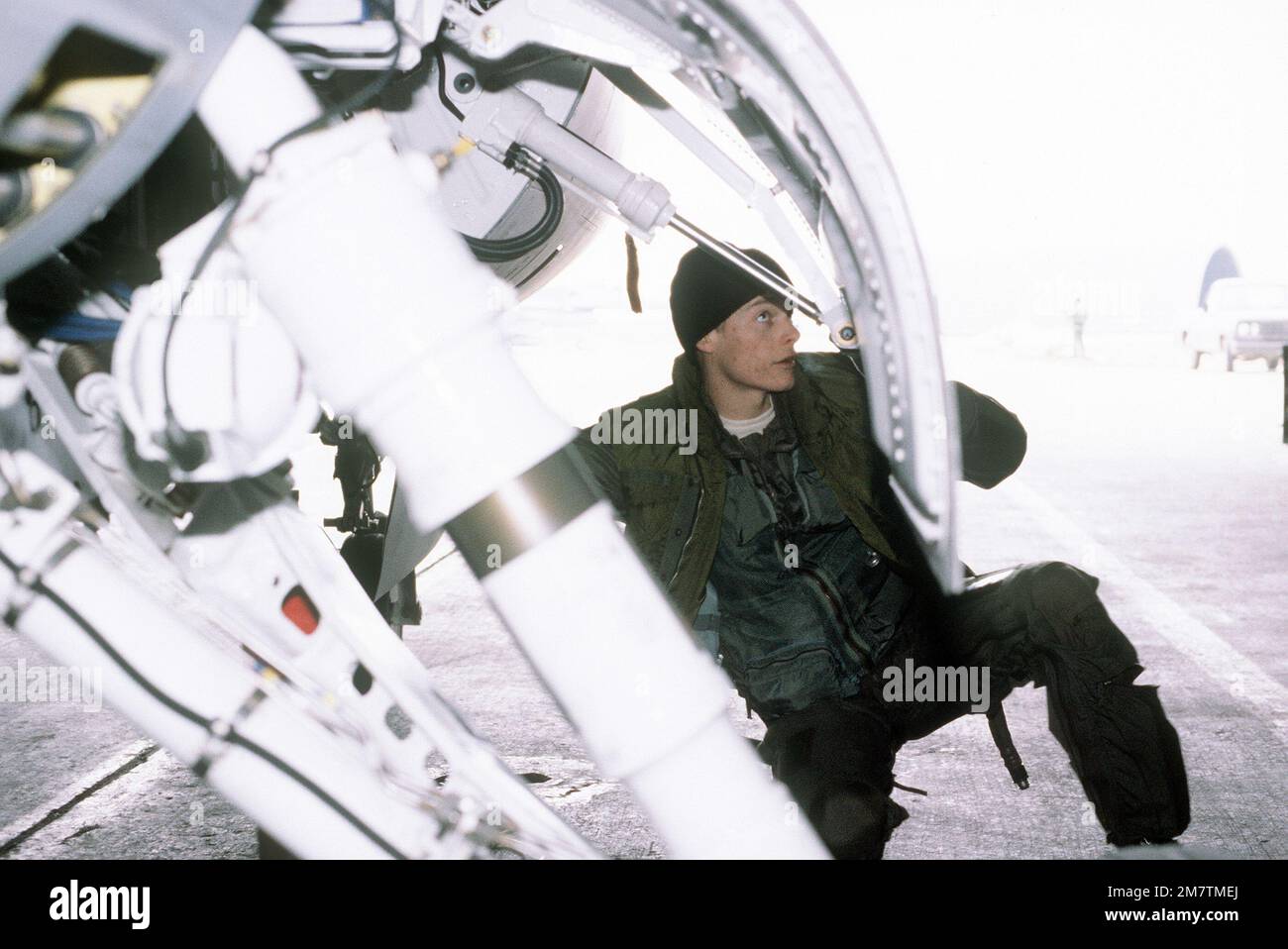 CPT Kim Peterson, 80th Tactical Fighter Squadron, pre-flights his F-16 ...