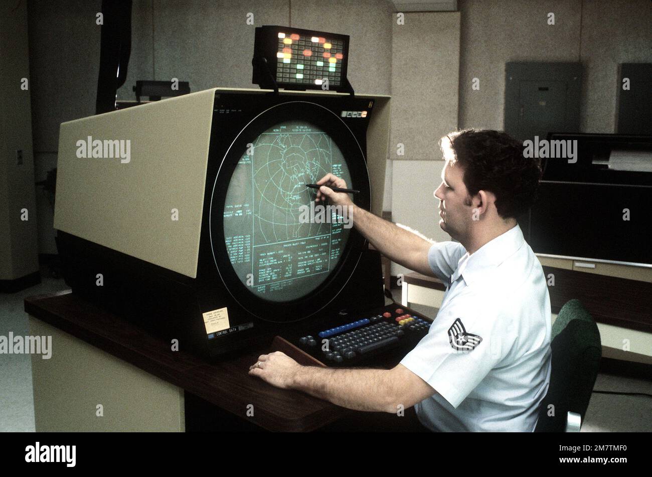 A staff sergeant monitors a radar scope and checks a missile course on ...