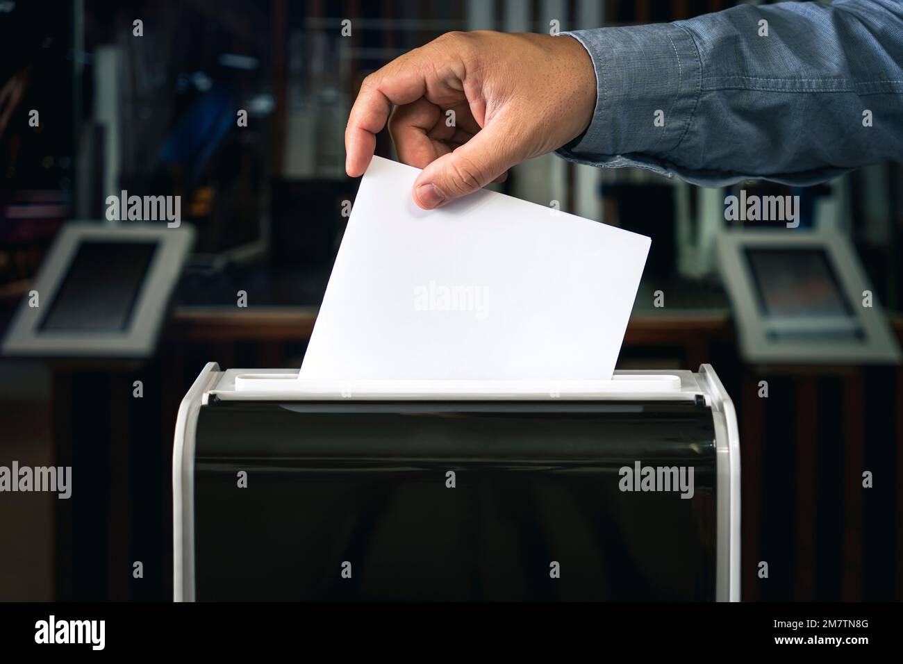 Hand holding ballot paper for election vote concept at place election ...