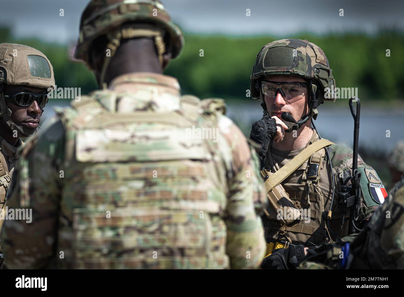 U.S. Soldiers and French soldiers speak during a wet-gap crossing ...
