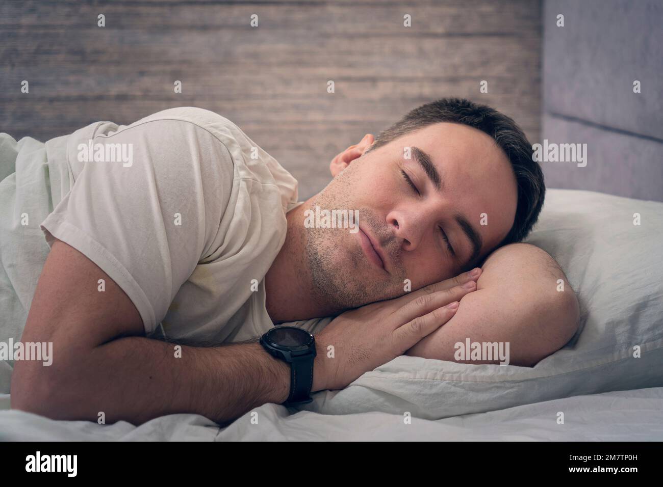 sleeping beautiful man. A satisfied expression on his face. A young guy ...