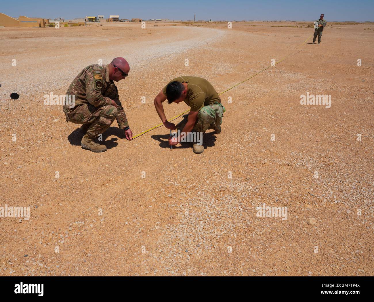 U.S. Air Force Airmen from the 379th Air Expeditionary Wing insert a ...