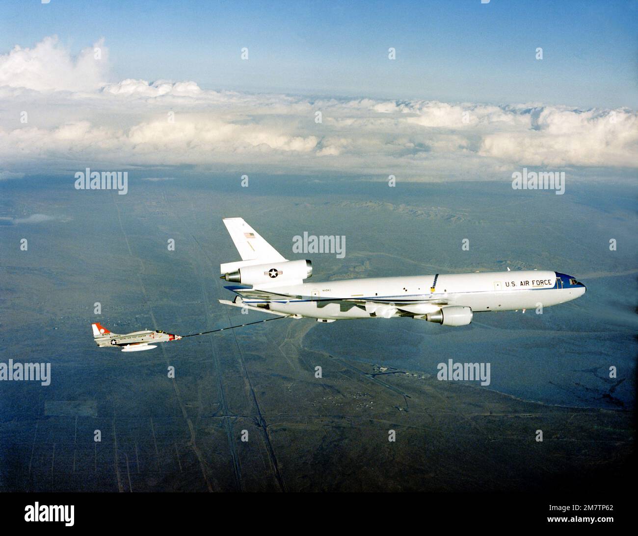 AN air-to-air right side view of a KC-10A aircraft refueling an A-4 ...