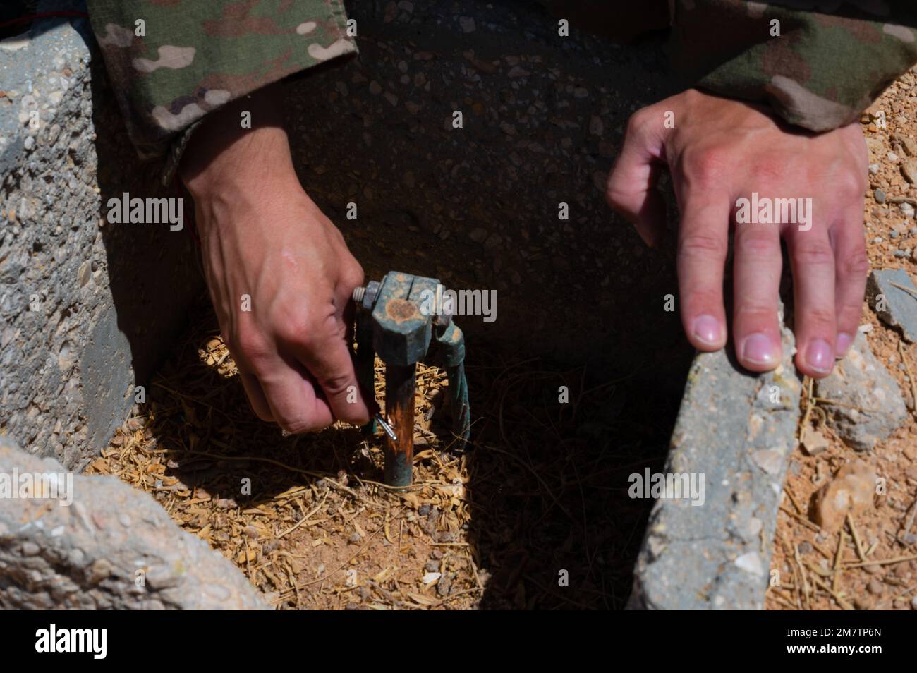 A U.S. Air Force Airman from the 379th Air Expeditionary Wing holds a ...