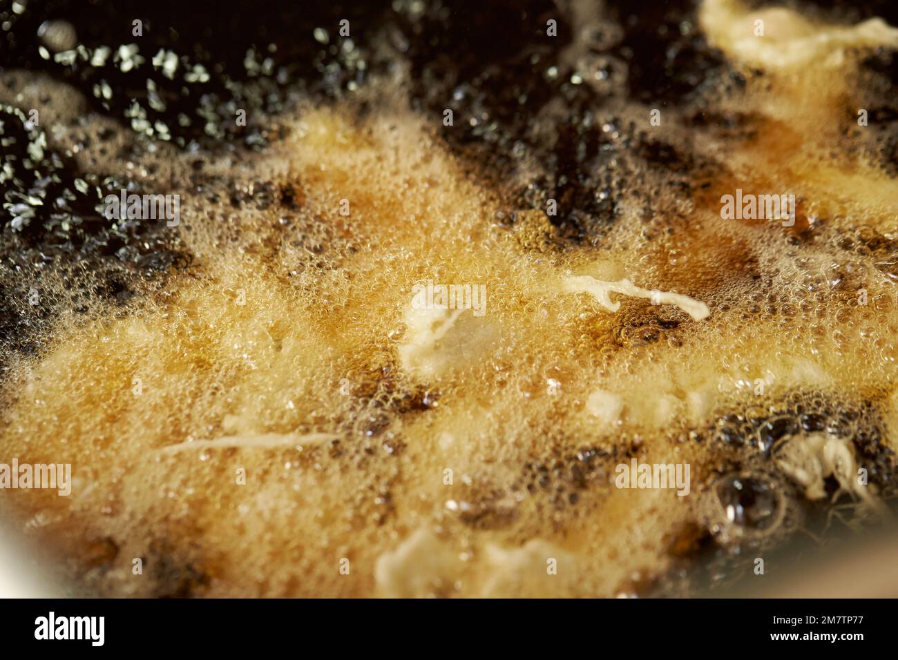 food being fried in oil Stock Photo - Alamy