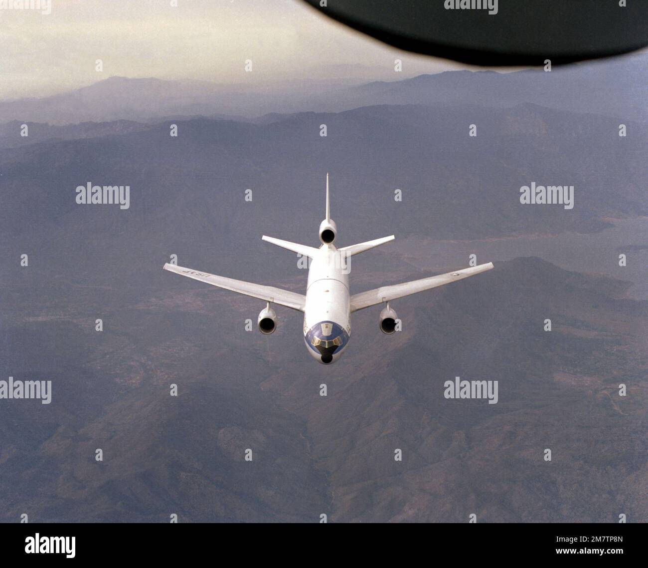 An overhead front view of a KC-10A Extender aircraft as seen from the boom operator's position ...