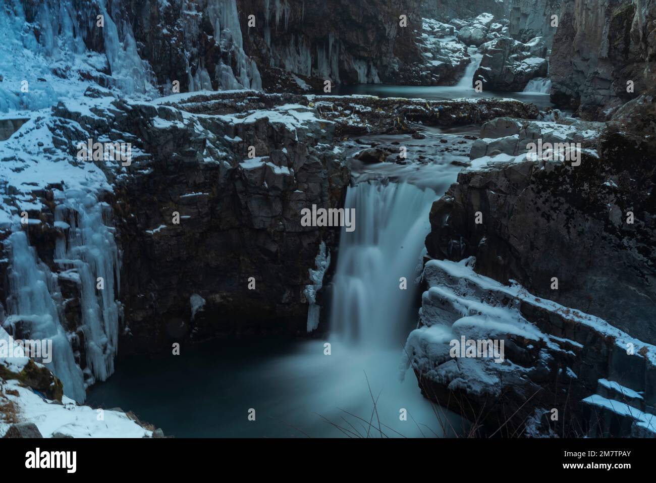A long exposure shot of partially Aharbal waterfall during a cold ...