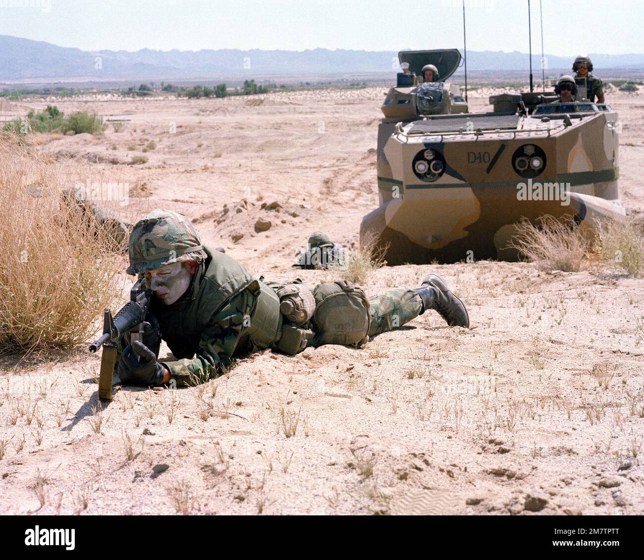 Three infantrymen from Company B, 1ST Battalion, 4th Marines, are in a ...