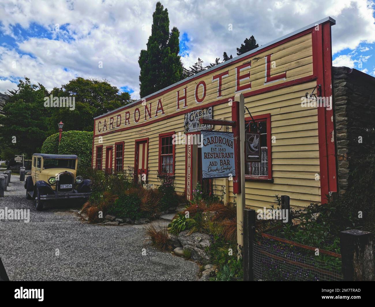 A vintage car parked in front of the Cardrona Hotel and Wanaka Pub in ...