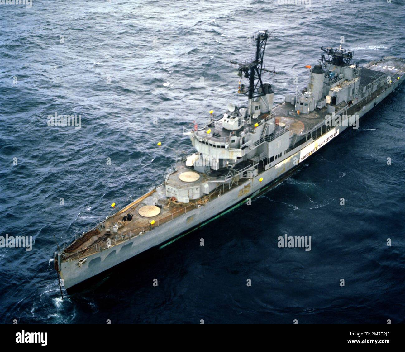 An aerial view of the target ship ex-USS BAUSELL during damage ...