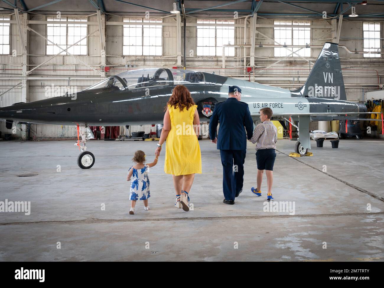 Lt. Col. Jared Yankech and his family walk towards the T-38 Talon for ...