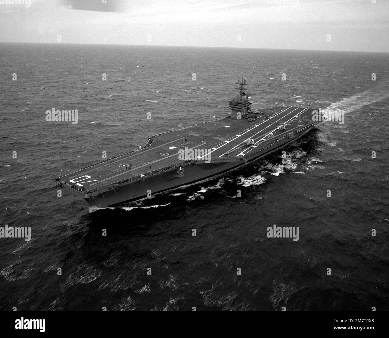 An aerial port bow view of the nuclear-powered aircraft carrier USS ...
