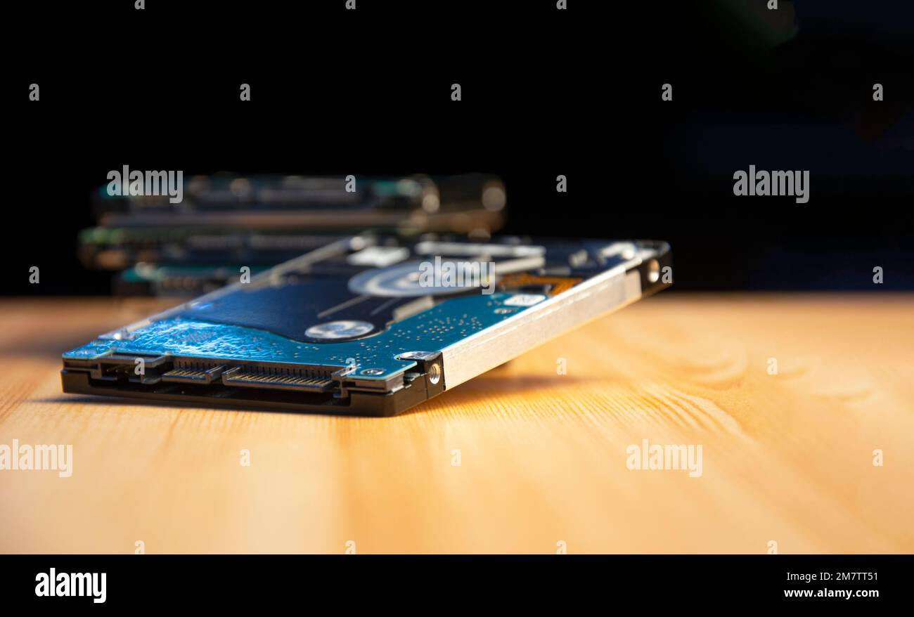 Close-up side view of hard disk on wooden floor Stock Photo - Alamy