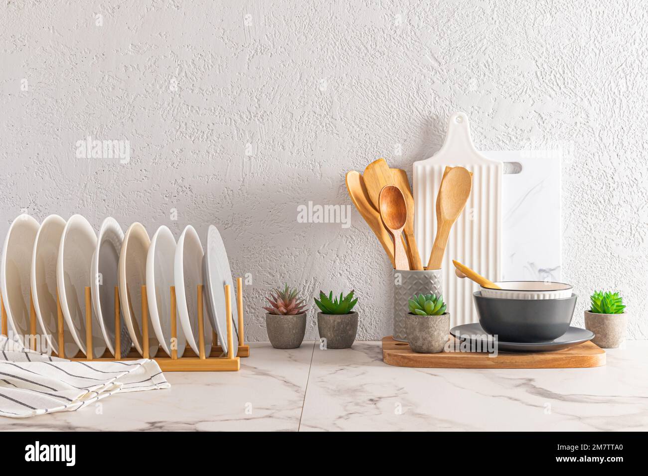 background kitchen utensils. front view of the dryer with plates ...