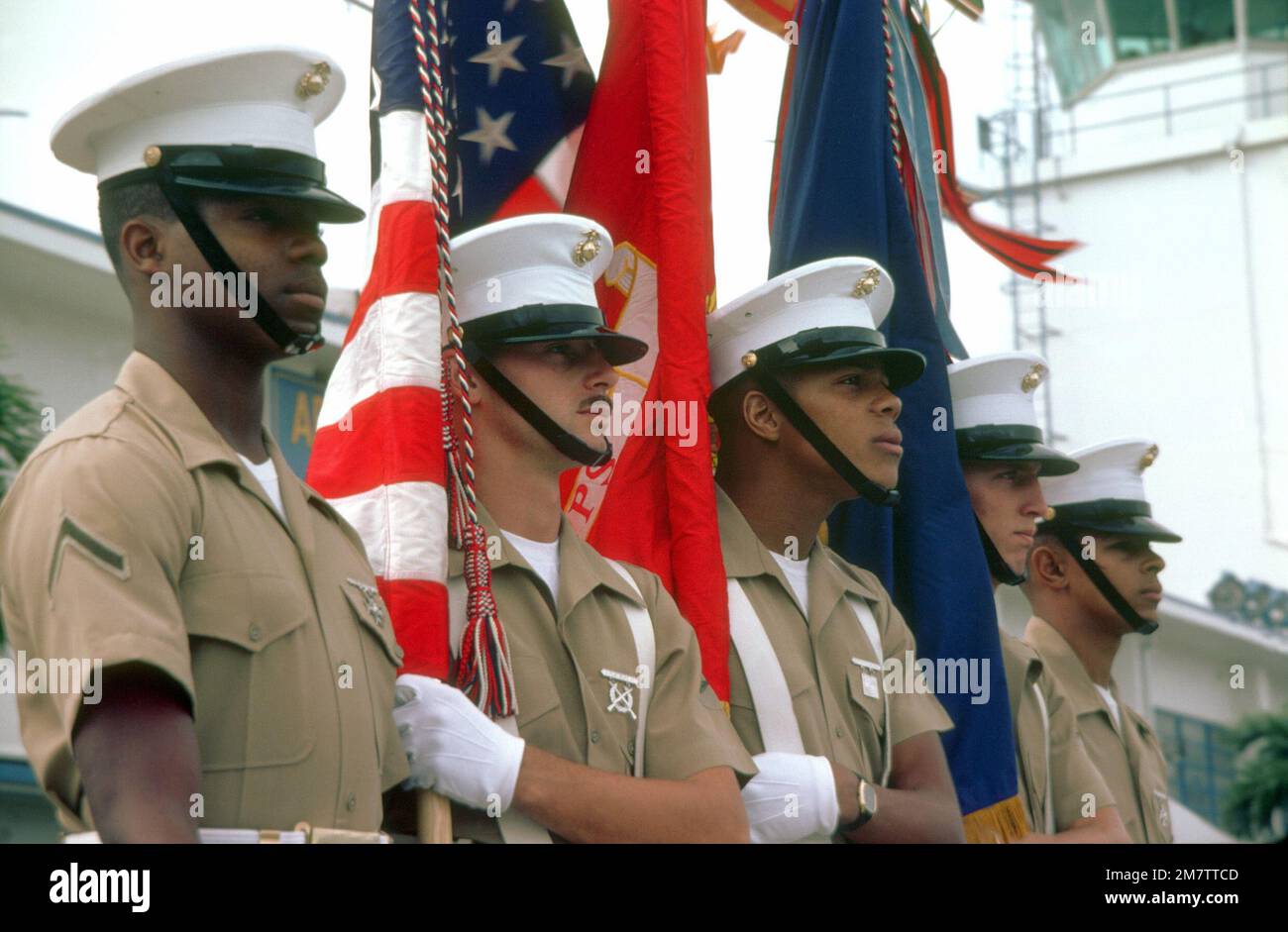 A U.S. Marine Corps color guard awaits inspection by Assistant ...
