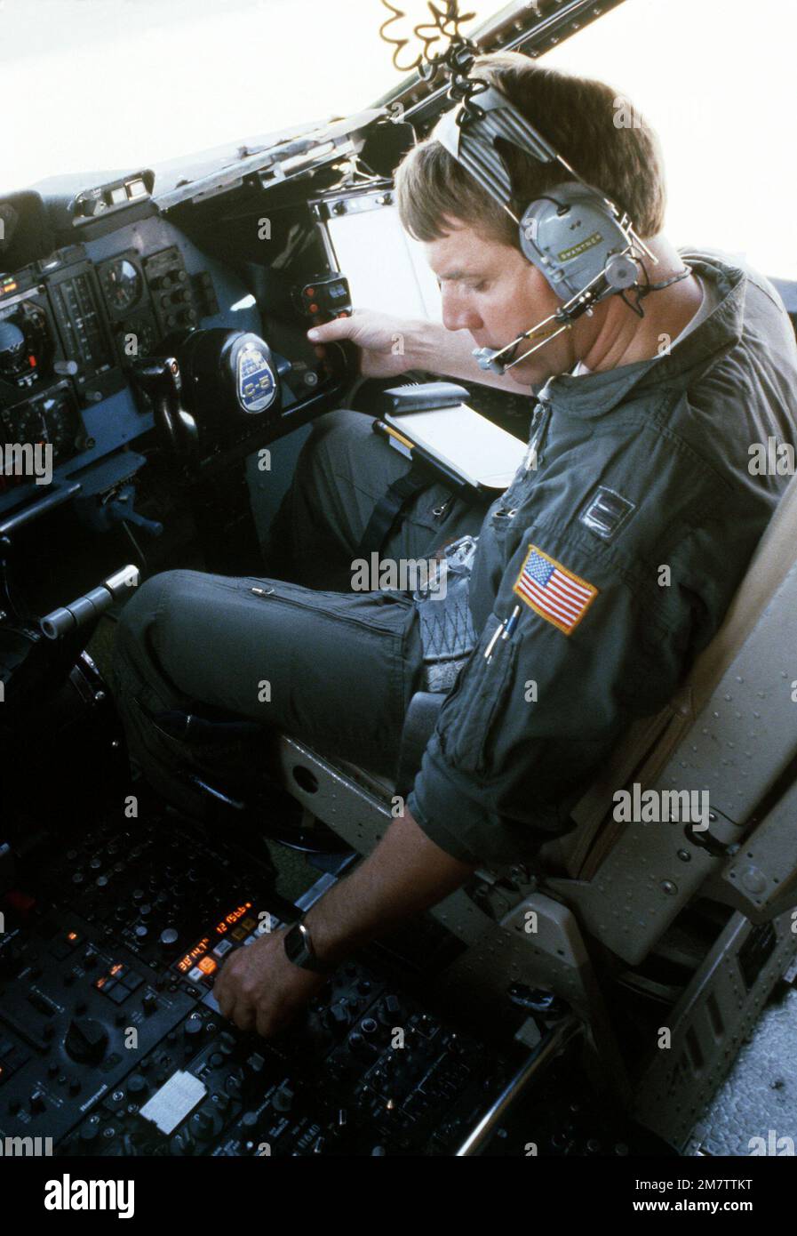 CPT Larry Swatner, a C-5 Galaxy co-pilot, enters data into the new ...