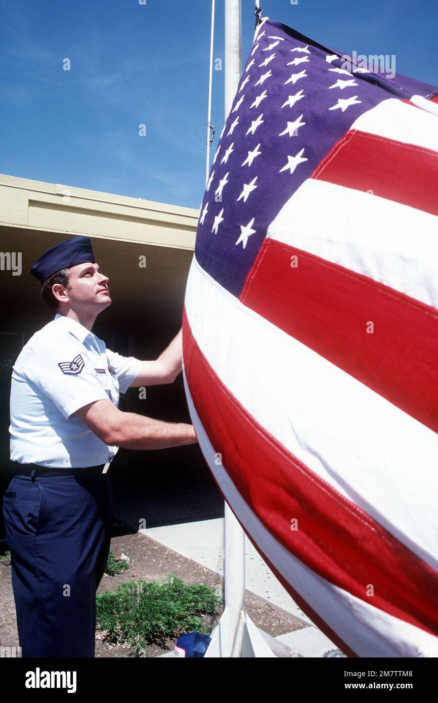 TSGT William P. "Wild Bill" Henneberger, an Air Force recruiter, raises ...