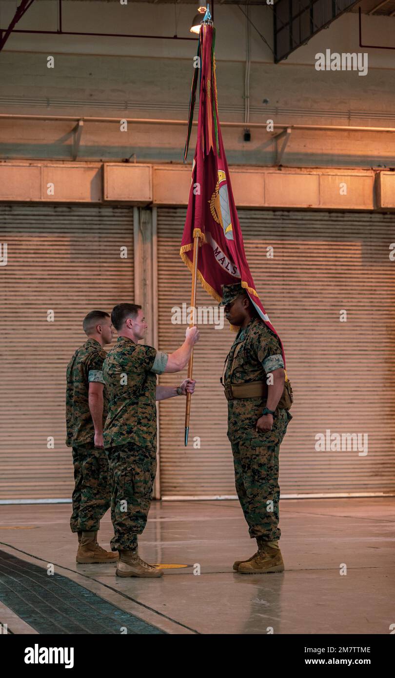 U.S. Marine Corps Lt. Col. Matthew Haley, middle, the outgoing ...