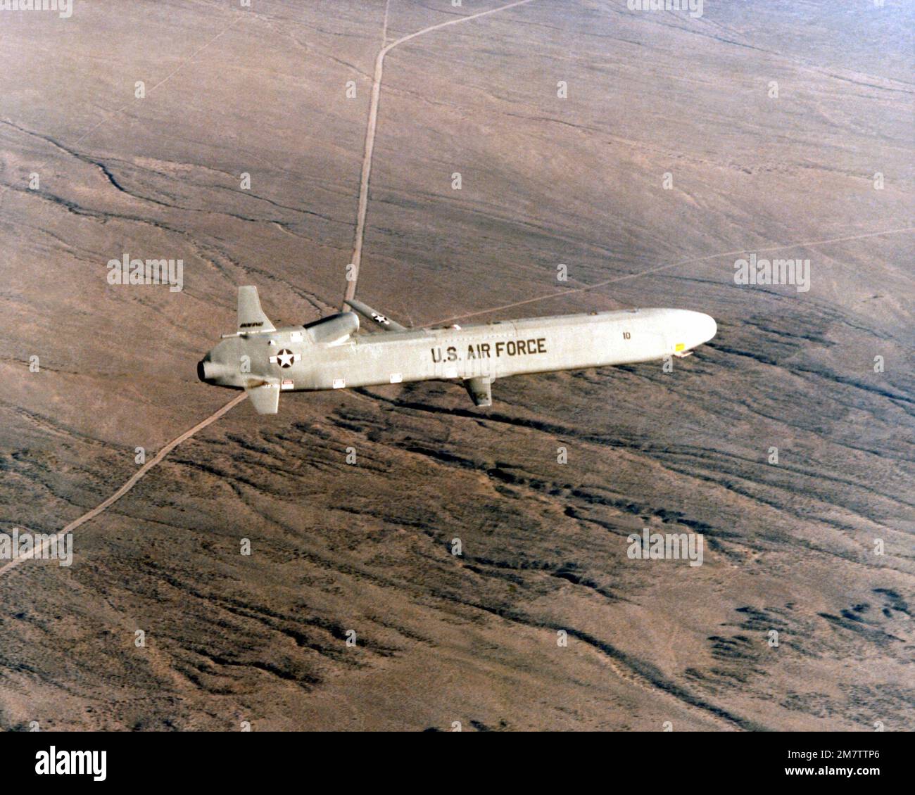 An air-to-air right side view of an air-launched cruise missile (ALCM ...