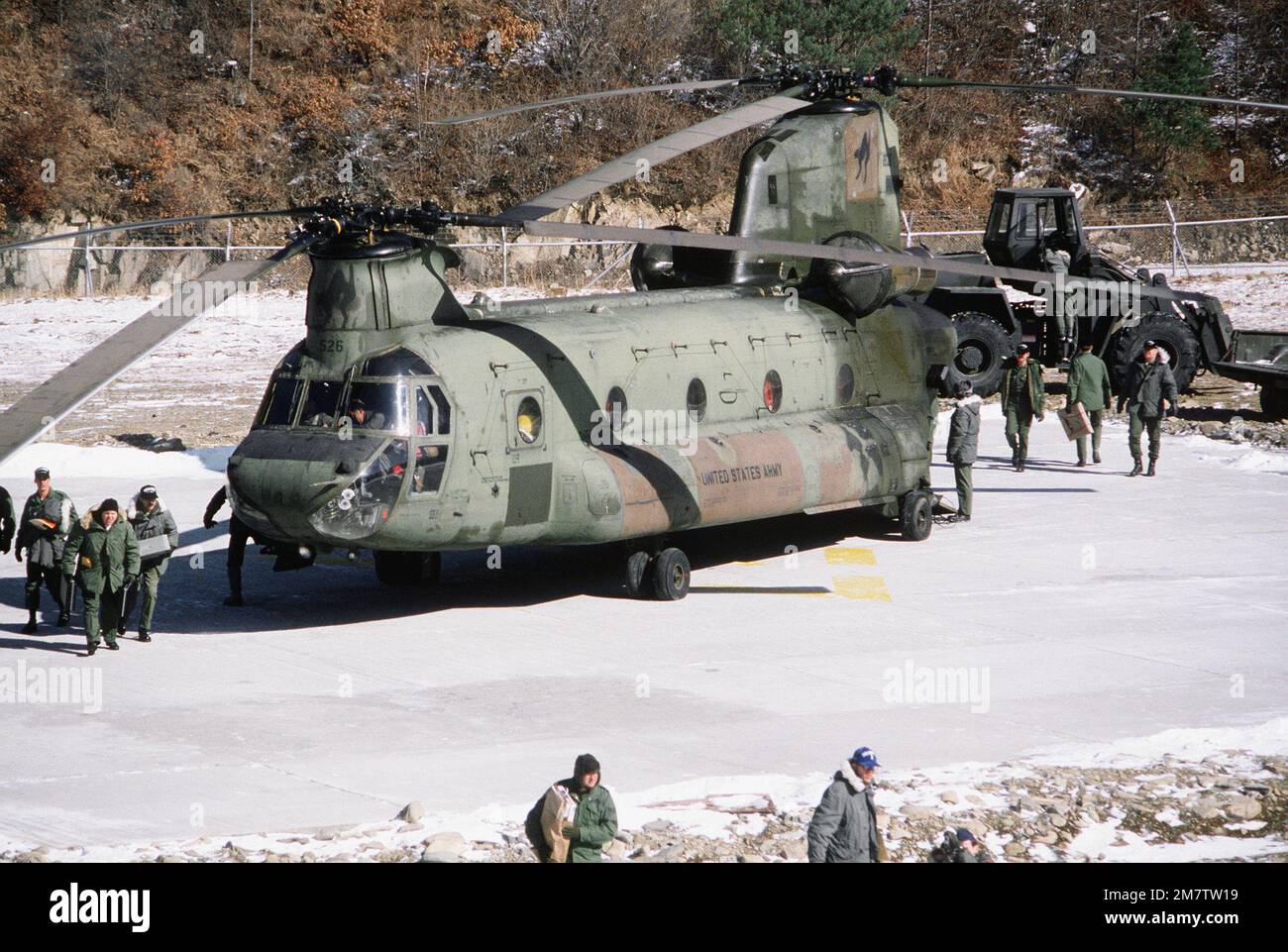 A U.S. Army CH-47 Chinook helicopter lands with supplies at the base ...
