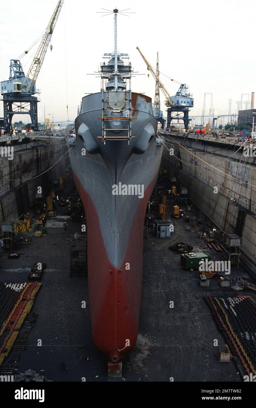 A bow view of the battleship USS NEW JERSEY (BB-62) in drydock. The ...
