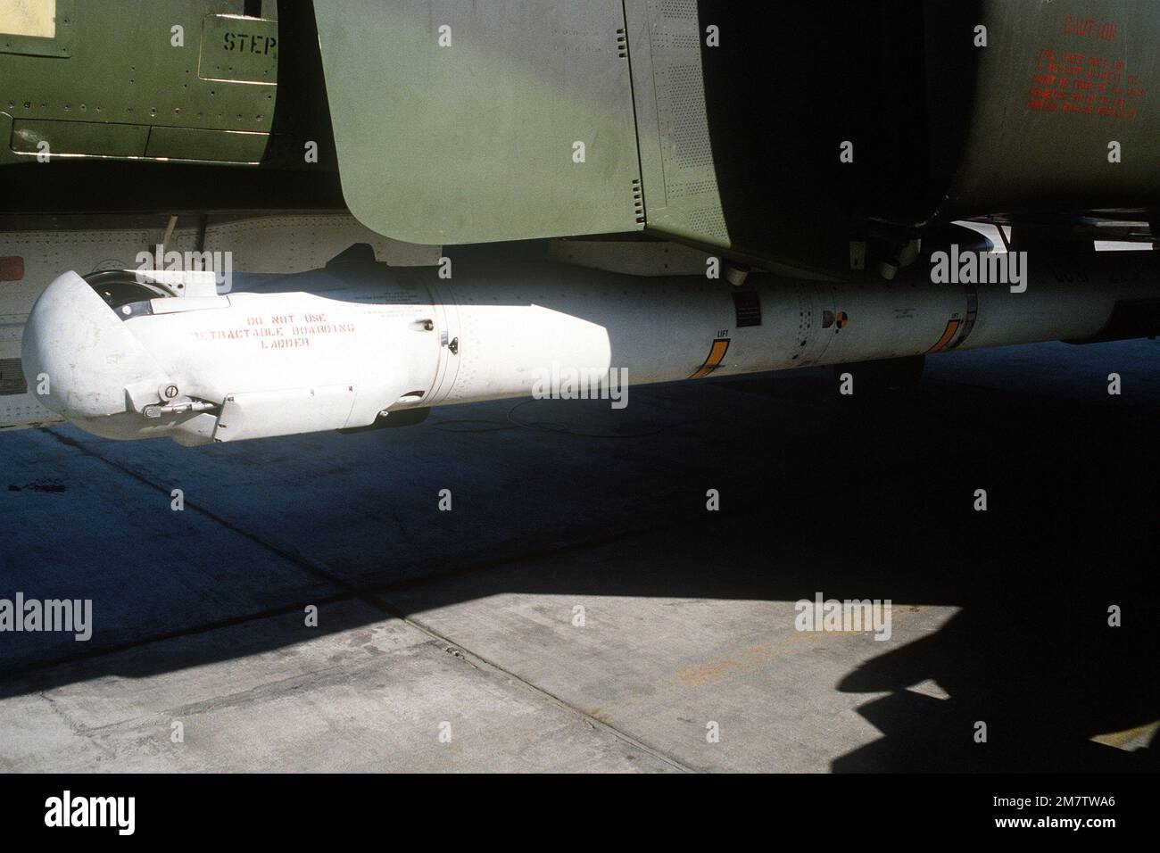 A close-up view of a PAVE SPIKE designator pod mounted beneath the wing ...