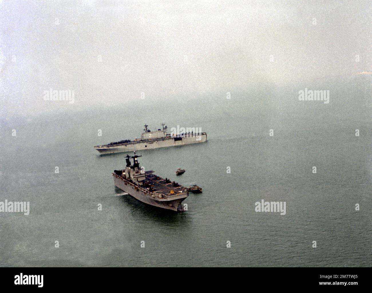 The passing of the amphibious assault ship USS NASSAU (LHA-4), in the ...