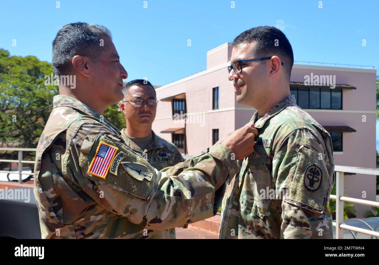 Col. Bill Soliz, commander, Tripler Army Medical Center, pins the Army ...