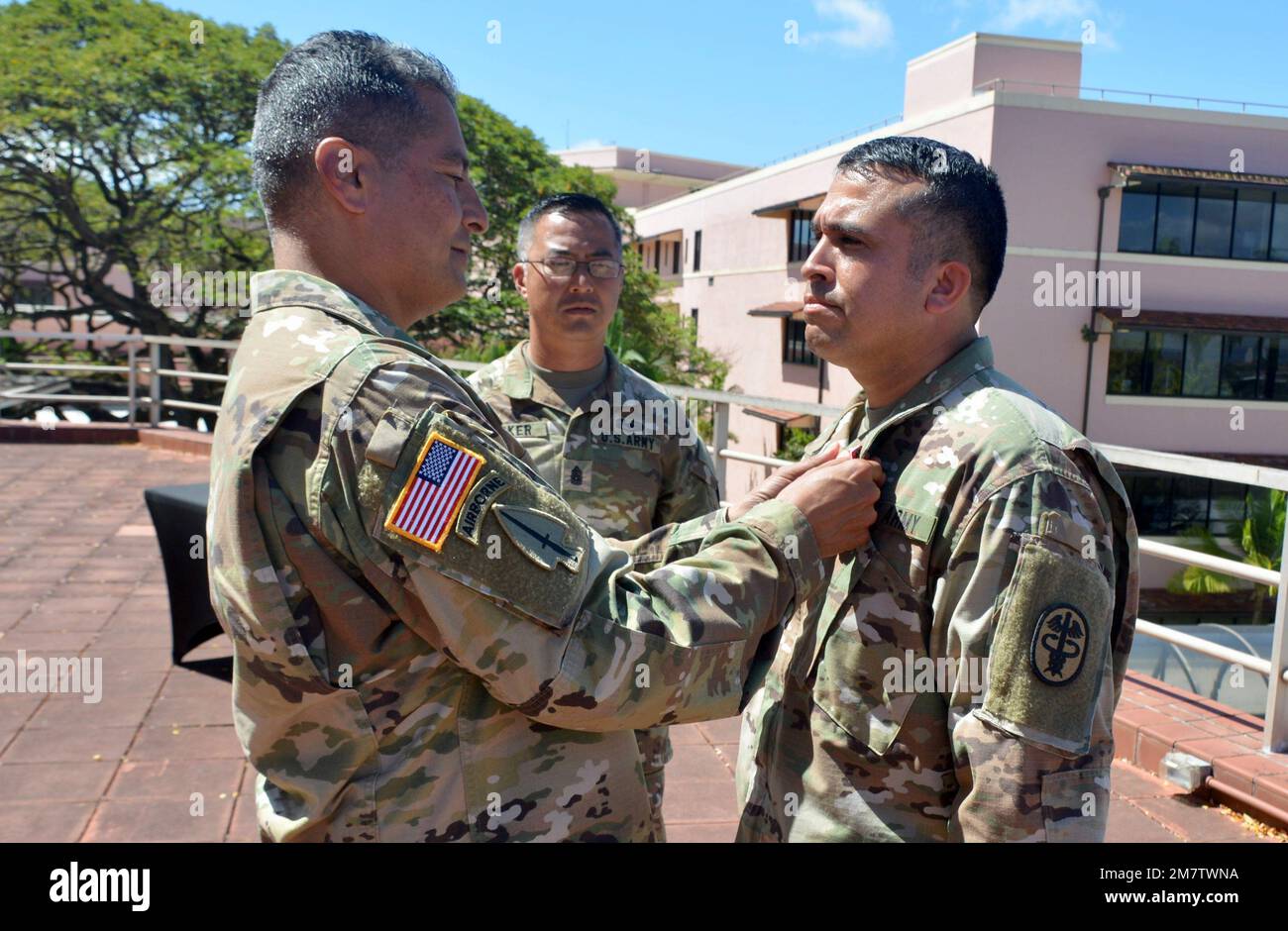 Col. Bill Soliz, commander, Triple Army Medical Center, pins the Army ...