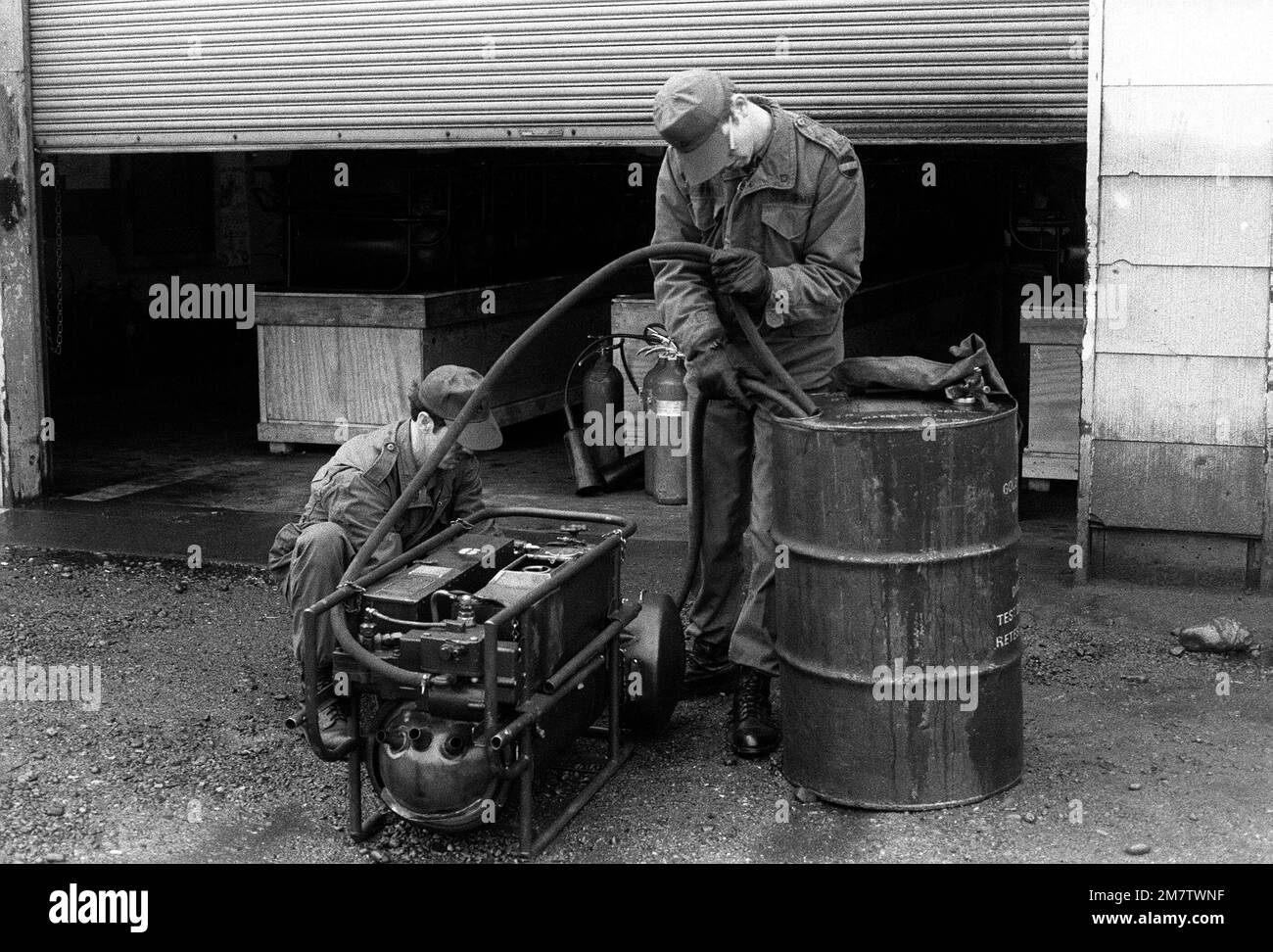 SSGT Clifford Hoffman, 164th Smoke Generator Detachment, adjusts an M ...