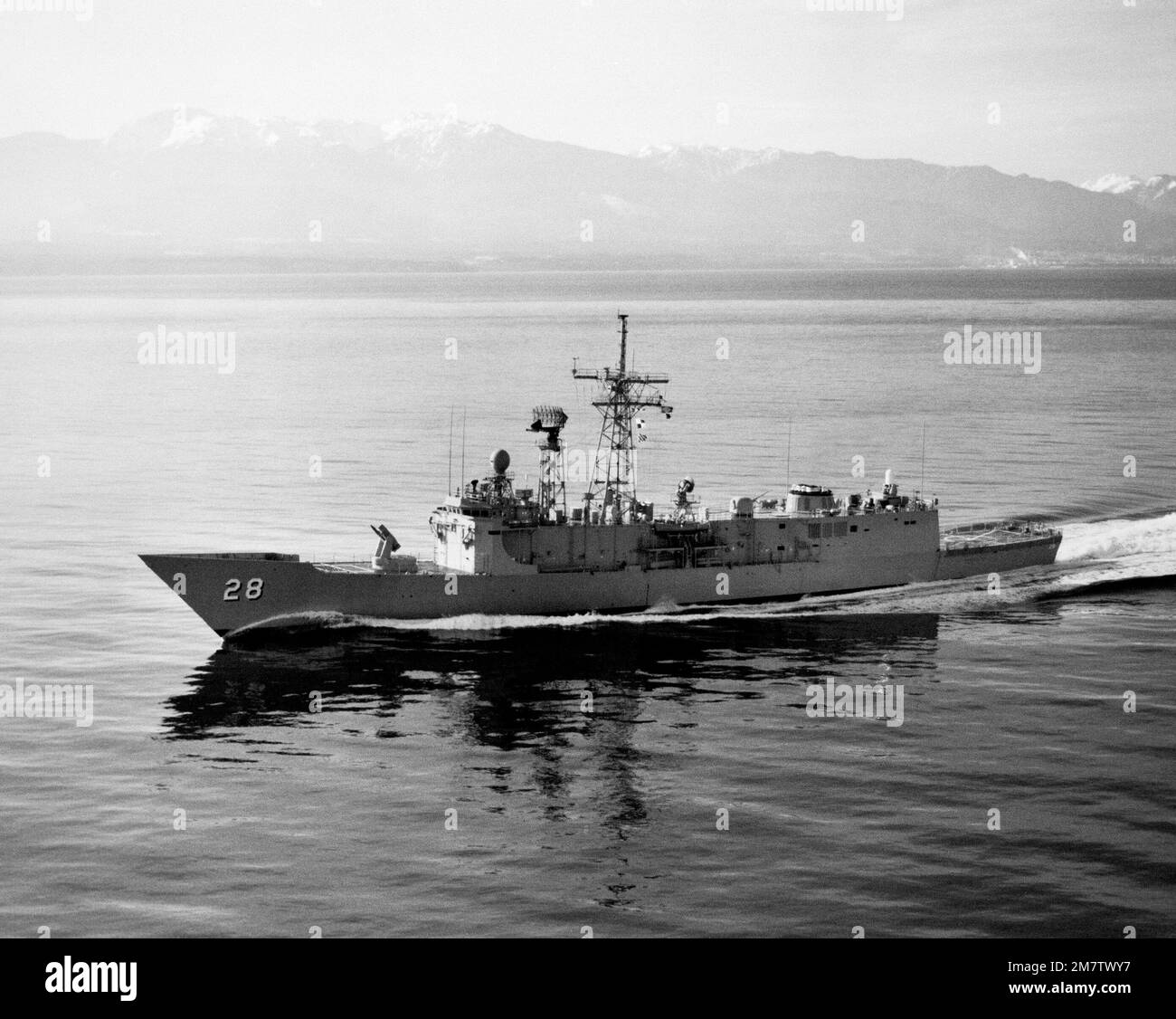 Aerial port bow view of the guided missile frigate USS BOONE (FFG 28 ...