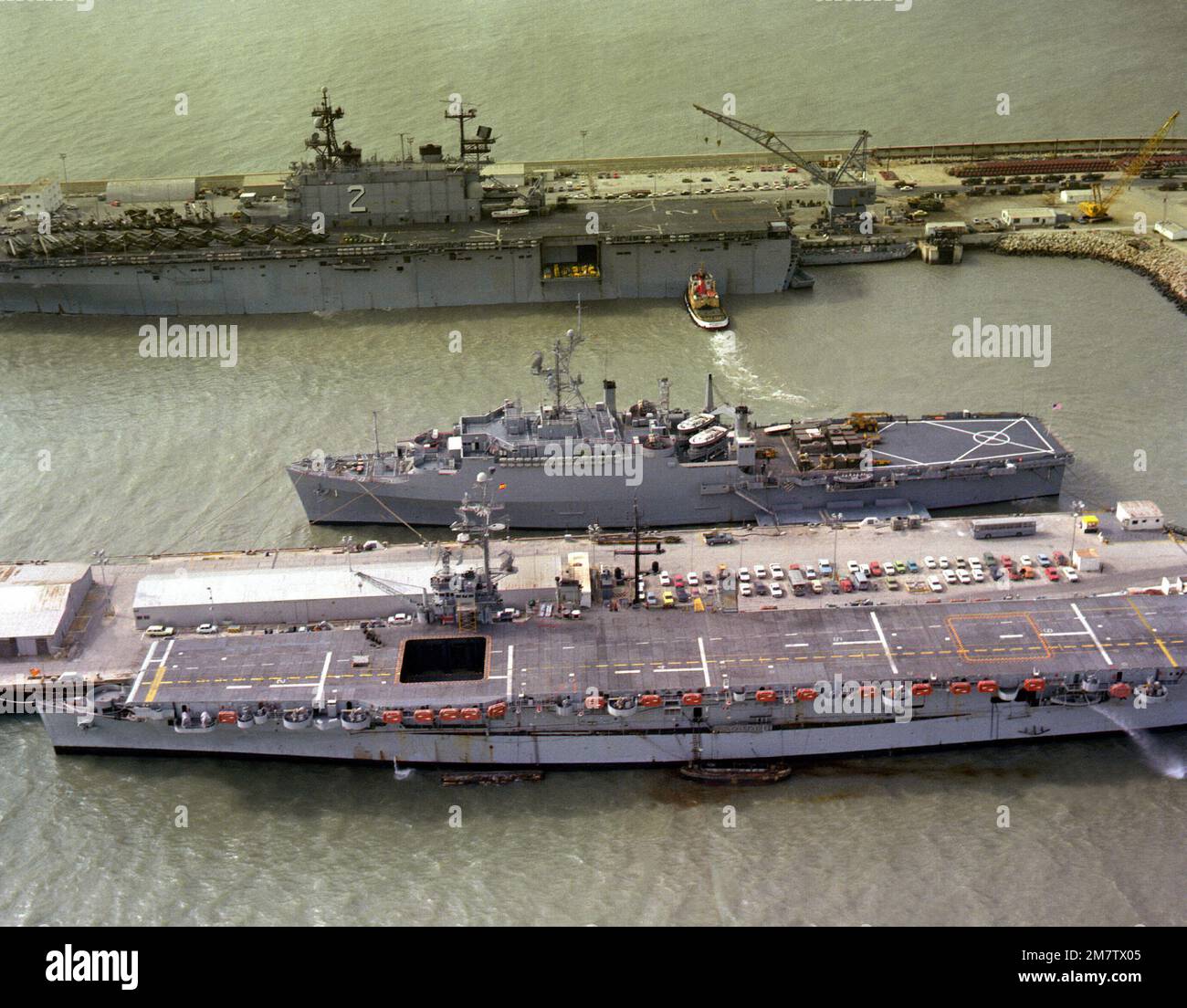 An aerial view of ships anchored. The ships are, from front to back ...