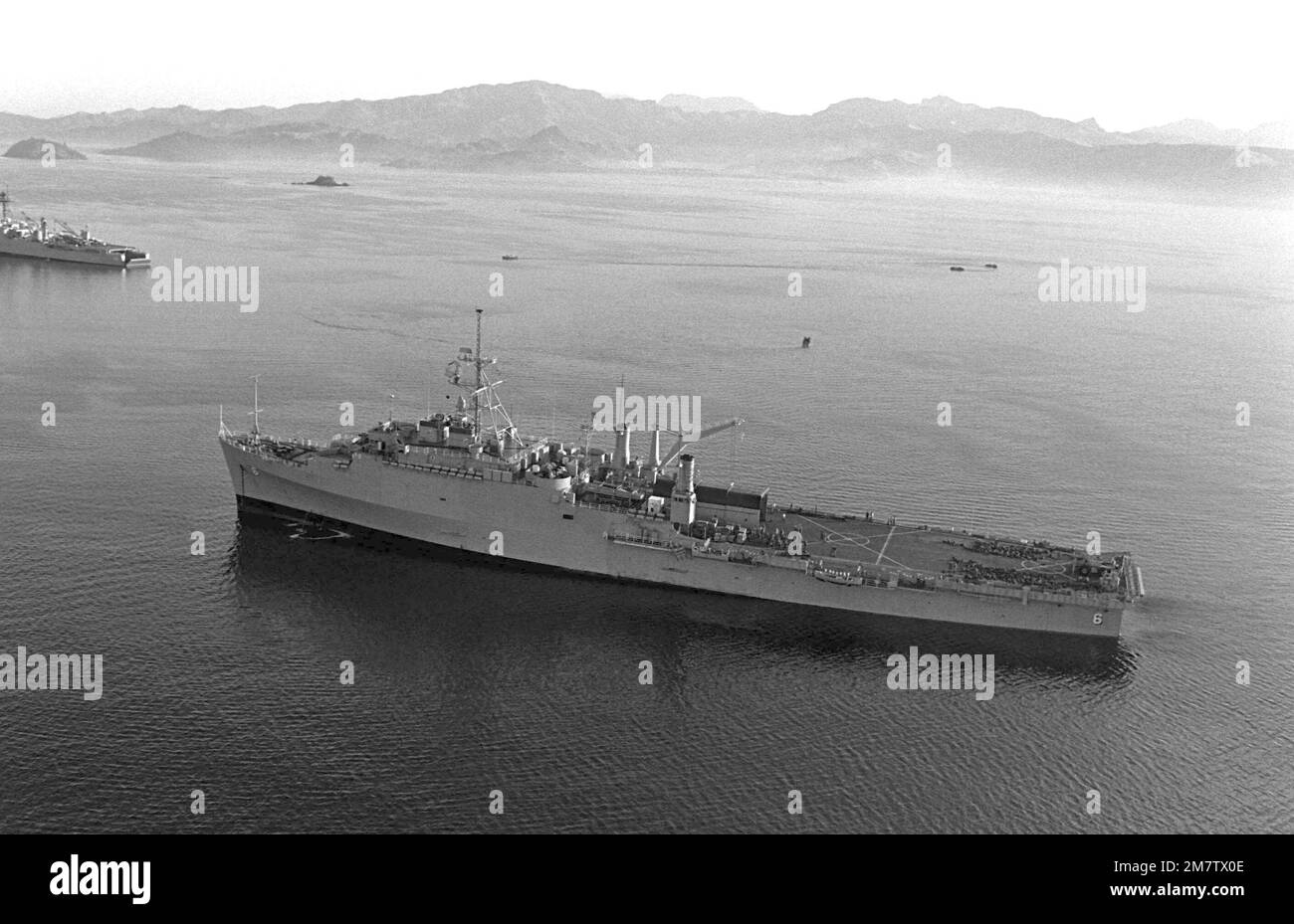 An aerial port beam view of the Austin-class amphibious transport dock ...