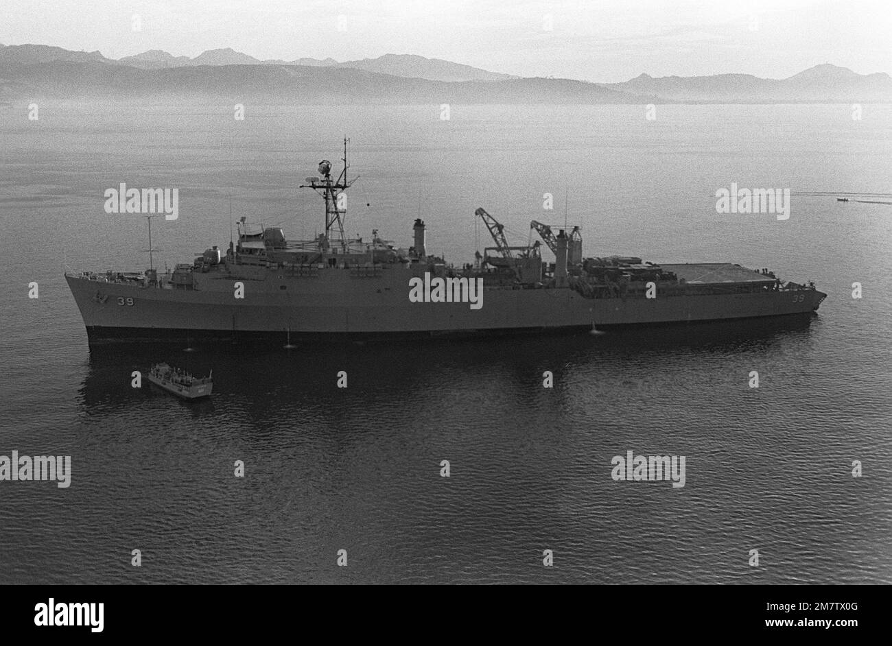 An aerial port beam view of the Anchorage-class dock landing ship USS ...