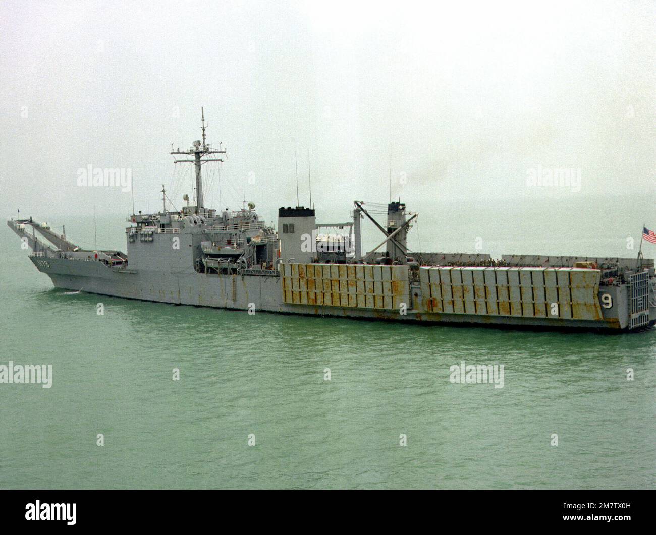 A port quarter view of the tank landing ship USS NEWPORT (LST-1179 ...