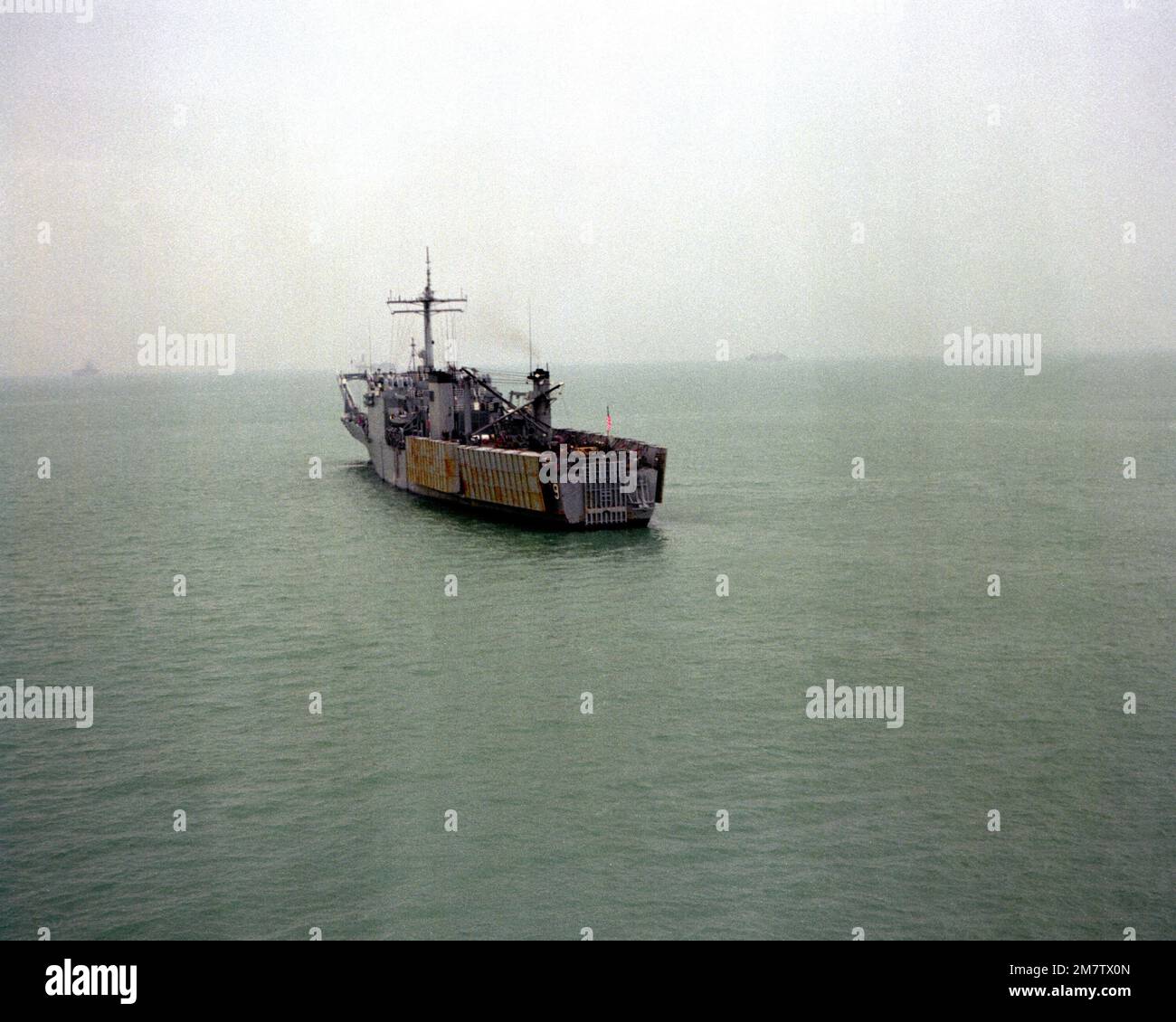 A port quarter view of the tank landing ship USS NEWPORT (LST-1179 ...