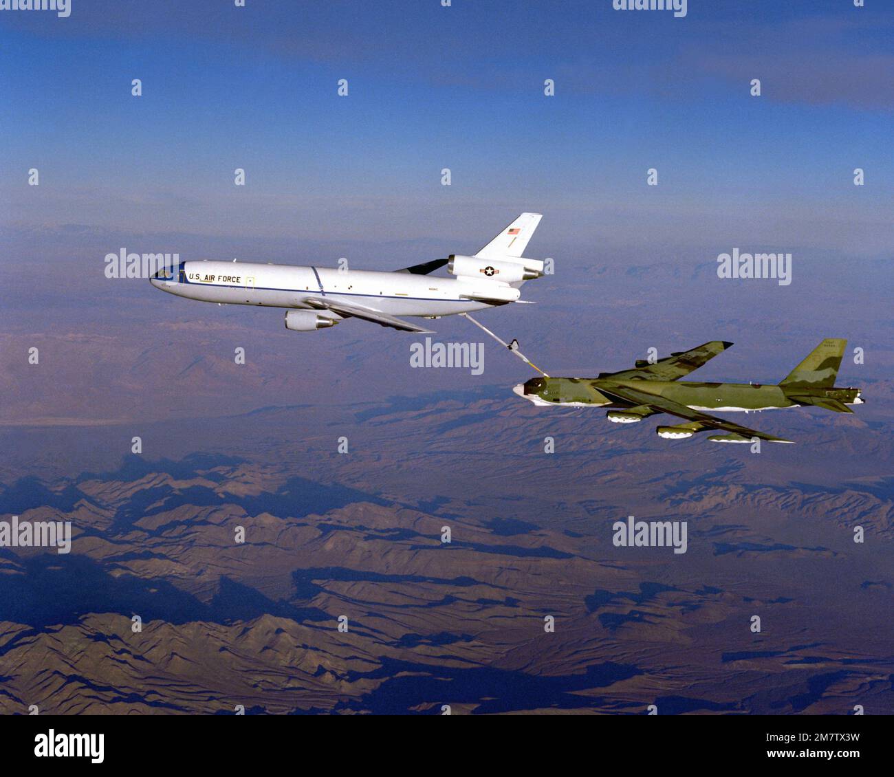 AN air-to-air left side view of a KC-10A Extender aircraft, left ...