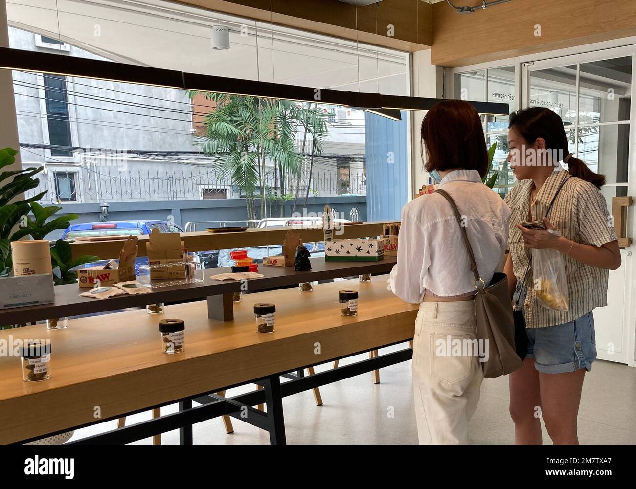 Bangkok, Thailand. 08th Jan, 2023. Two female customers look at the ...