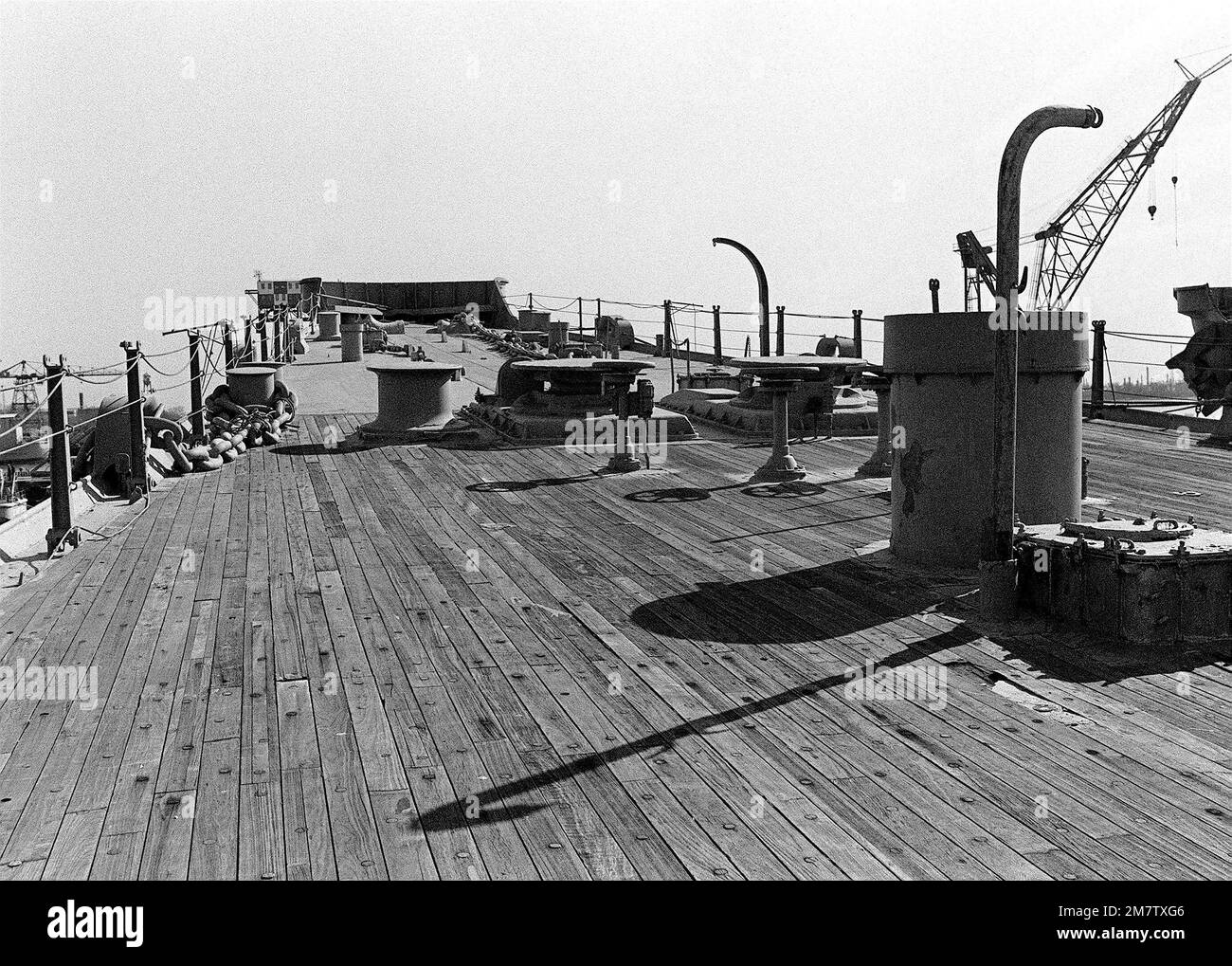 A view forward from the port side of "A" turret aboard the battleship ...