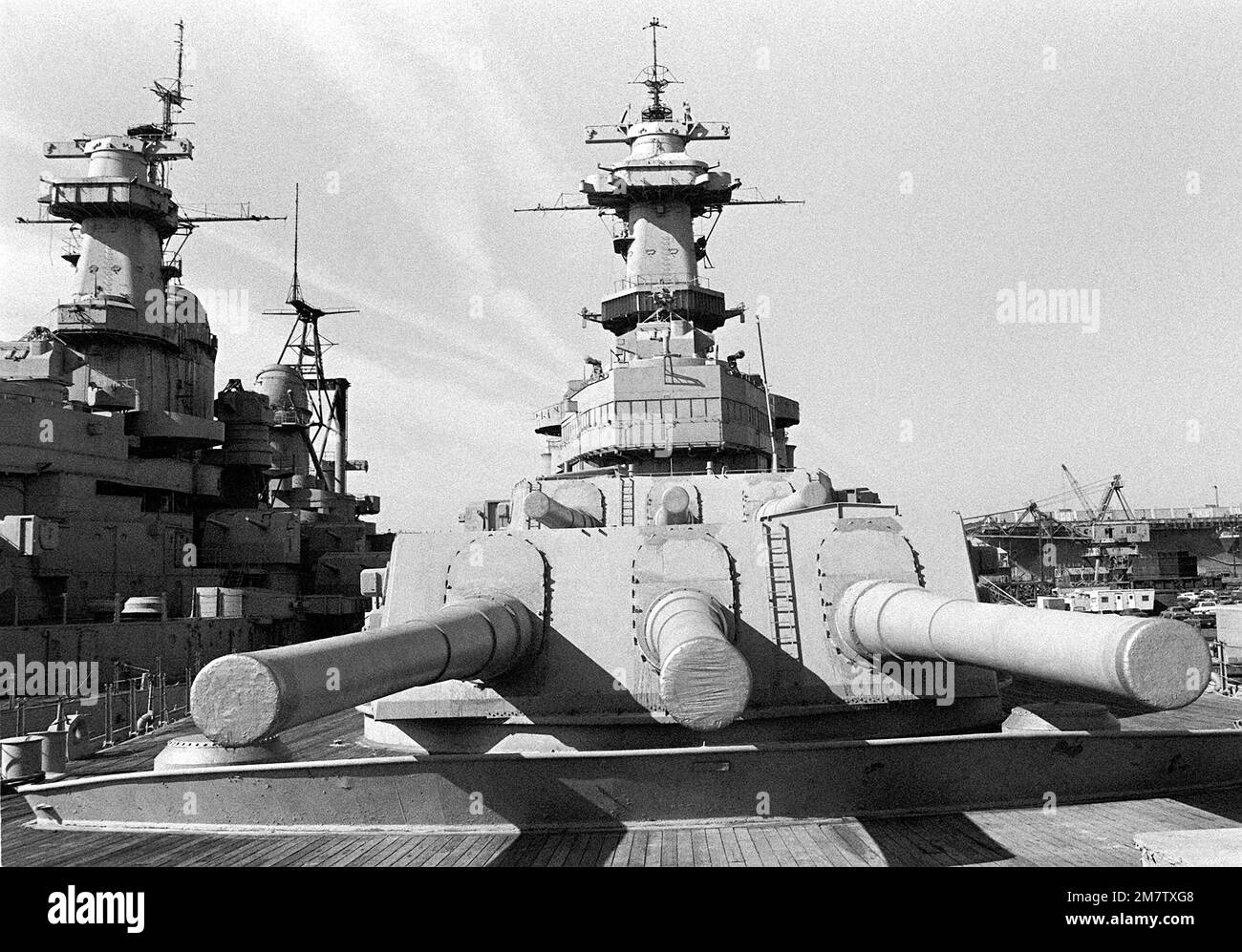 A view from the bow of "A" turret and the bridge aboard the battleship ...