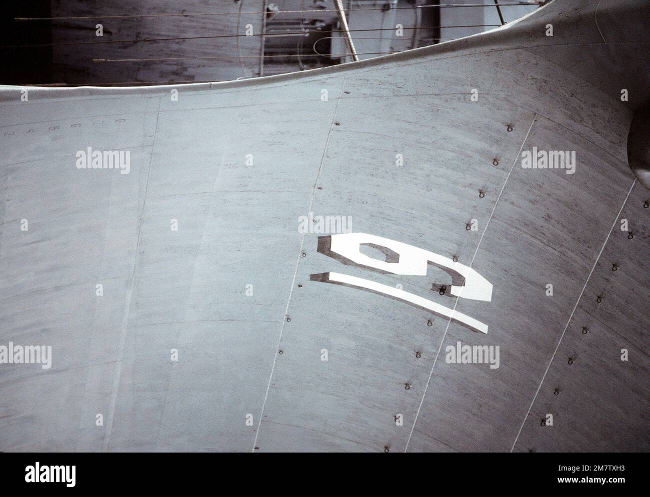 A close-up port view of the bow of the battleship IOWA (BB-61). The ...